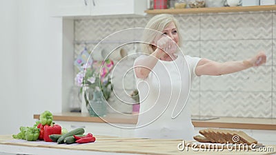 Healthy Senior Old Woman Dancing while Cooking in Kitchen Stock Footage ...