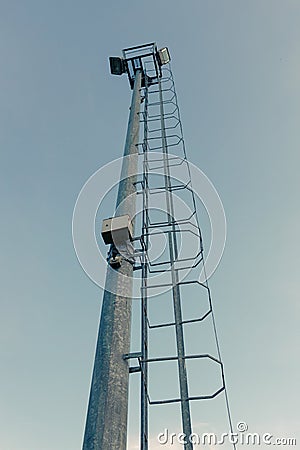 High Mast Of Spot Light With Ladder On Evening Blue Sky Background ...