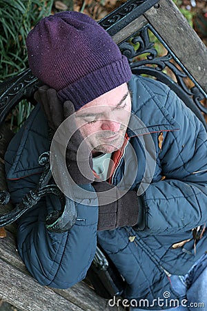Homeless Man Keeps Warm Royalty Free Stock Image - Image: 3921956