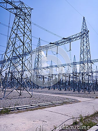 Huge Power Substation. High Voltage Electric Tower On Sky Background ...