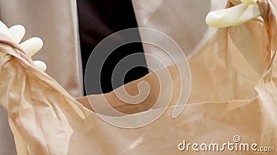 Human Hands in Rubber Gloves with a Garbage Bag Collect Plastic Waste ...