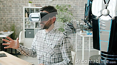Human and Robotic Arm Doing Same Movements, Guy in Vr Glasses Testing ...