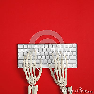 Human Skeleton Using Computer Keyboard On Red Background. Space For ...