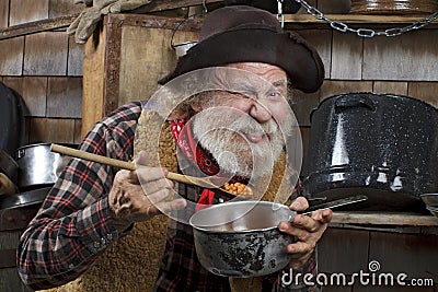 Hungry Old Cowboy Eating Beans From A Saucepan Royalty Free Stock ...