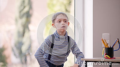 Hyperactive Autistic Boy Jumping Gesturing Indoors Laughing Having Fun ...