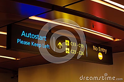Illuminated Travelator And Directional Signs Stock Photography ...