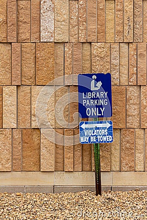 View Of A Library Parking Sign In Front Of An Modern Limestone Wall ...