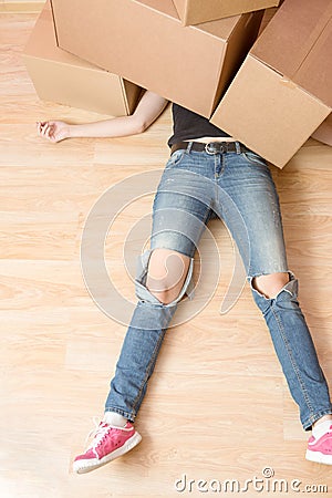 Image Of Woman In Jeans Lying Under Cardboard Boxes Stock Photography ...