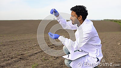 Indian Scientist Studying Sample of Soil in Field Stock Video - Video ...