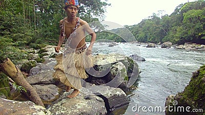 Indigenous Hunter Jumping on the Stones in the Amazon Rainforest Stock ...