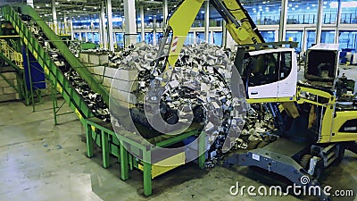 Industrial Machine Puts Rubbish into Container at a Factory. Plastic ...