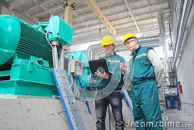 Industrial Workers With Notebook Stock Photo - Image: 24367760