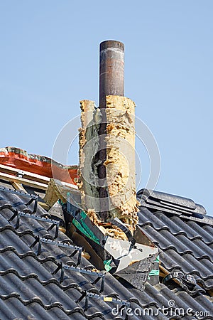 Installation Of Chimney With Exposed Isolation Layer On The Roof Stock ...