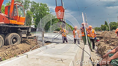 Installing Concrete Plates by Crane at Road Construction Site Timelapse ...