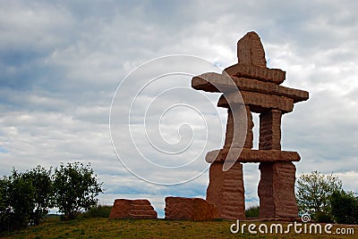 Inukshuk on water edge stock photo. Image of aboriginal - 1207340