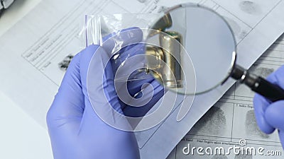 Investigator Analyzing Bullets Evidence from Murder Scene Using ...