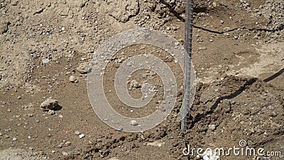 Iron Pins are Driven into the Ground. Concept of Building and Repairing ...