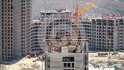 8K Cranes and Construction Workers Working at Worksite Stock Video ...