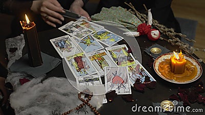 4K. a Witch Woman in a Dark Room Reading Tarot Cards Stock Video ...