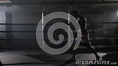 Kickbox Fighter Shadow Boxing in the Ring. the Athlete Fights with His ...