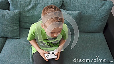 Kid Plays Console. Baby Boy Presses Joystick. Domestic Life and Leisure ...