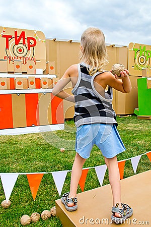 Kid Throwing Balls At A Target Stock Photo - Image: 43681271