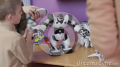 Kids playing with robots stock footage. Video of machine - 243178468
