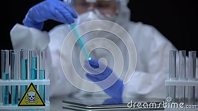 Lab Worker Inspecting Test Tubes with Poison for Sediments, Dissolution ...