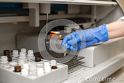 Laboratory Technician Test Blood In Automatic Blood Sample Analyzer ...