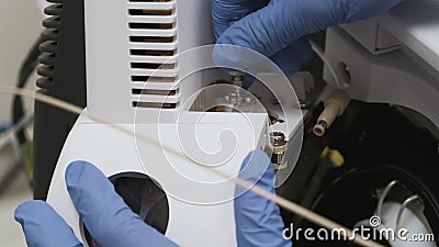 Laboratory Technician Unscrews the Capillary into the Nebulizer Needle ...