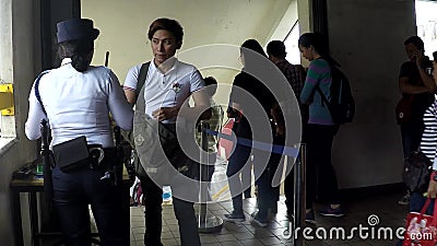 Lady Security Guard Inspects Handbags of Train Passengers Stock Footage ...
