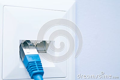 LAN Cable Plugged Into The Wall Outlet Stock Photo - Image: 42051226