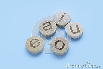 Learning English Concept.Vowels Of AEIOU On A Blue Background Stock ...