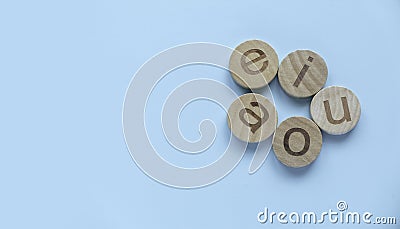 Learning English Concept.Vowels Of AEIOU On A Blue Background. Copy ...