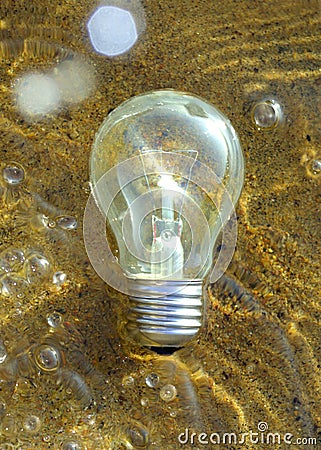 Lightbulb Floating In The Water, Alive With A Bit Of Light. Stock Photo ...