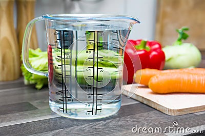 1 Liter / 1000ml / 10dl Of Water In A Measuring Cup On A Kitchen ...