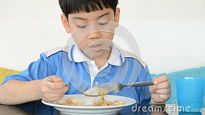 Little Asian Boy Eating Fried Rice . Stock Video - Video of asia, adult ...