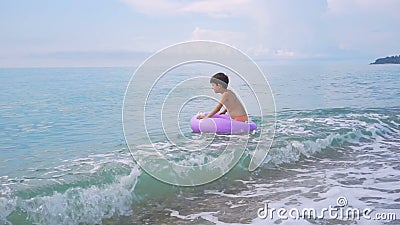 Child Floating in Sea on Inflatable Ring Stock Video - Video of ring ...
