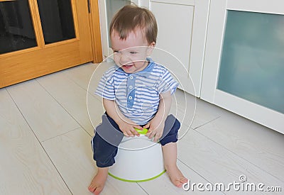 A Little Boy Learns To Go Potty. Accustom The Child To The Potty Stock ...