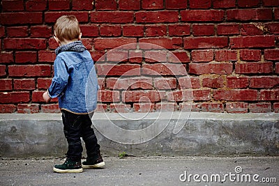 Little Boy Near Red Brick Wall Royalty-Free Stock Image | CartoonDealer ...