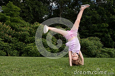 Little Girl Doing A Cartwheel Royalty Free Stock Images - Image: 25563029