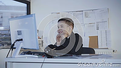 Little Handsome Boy Working with Smile at Computer in Office. 4K Stock ...