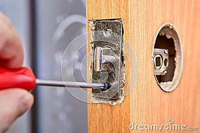 Locksmith Secures Latch Plate For Interior Door Knob Royalty-Free Stock ...