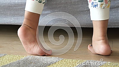 Low Angle View of a Child Walking on Tiptoes Stock Footage - Video of ...