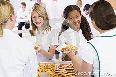 Lunchladies Serving Plates Of Lunch In A School Royalty Free Stock ...
