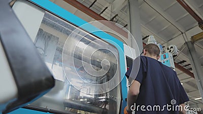 The Machine Operator Creates Parts with a Mold. Operator at the Molding ...