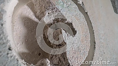 Macro Shot of a Process Gouging Round Hole in Plaster Wall for Socket ...