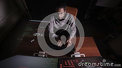 Male Arabic Hacker Hacks Computer in Dark. Computer Code Reflecting on ...