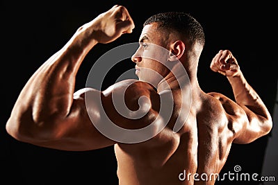 Male Bodybuilder Flexing Muscles, Side View Stock Image | CartoonDealer ...