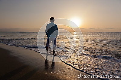 Man Alone On Beach Watching The Sunset Stock Photo - Image: 33192310